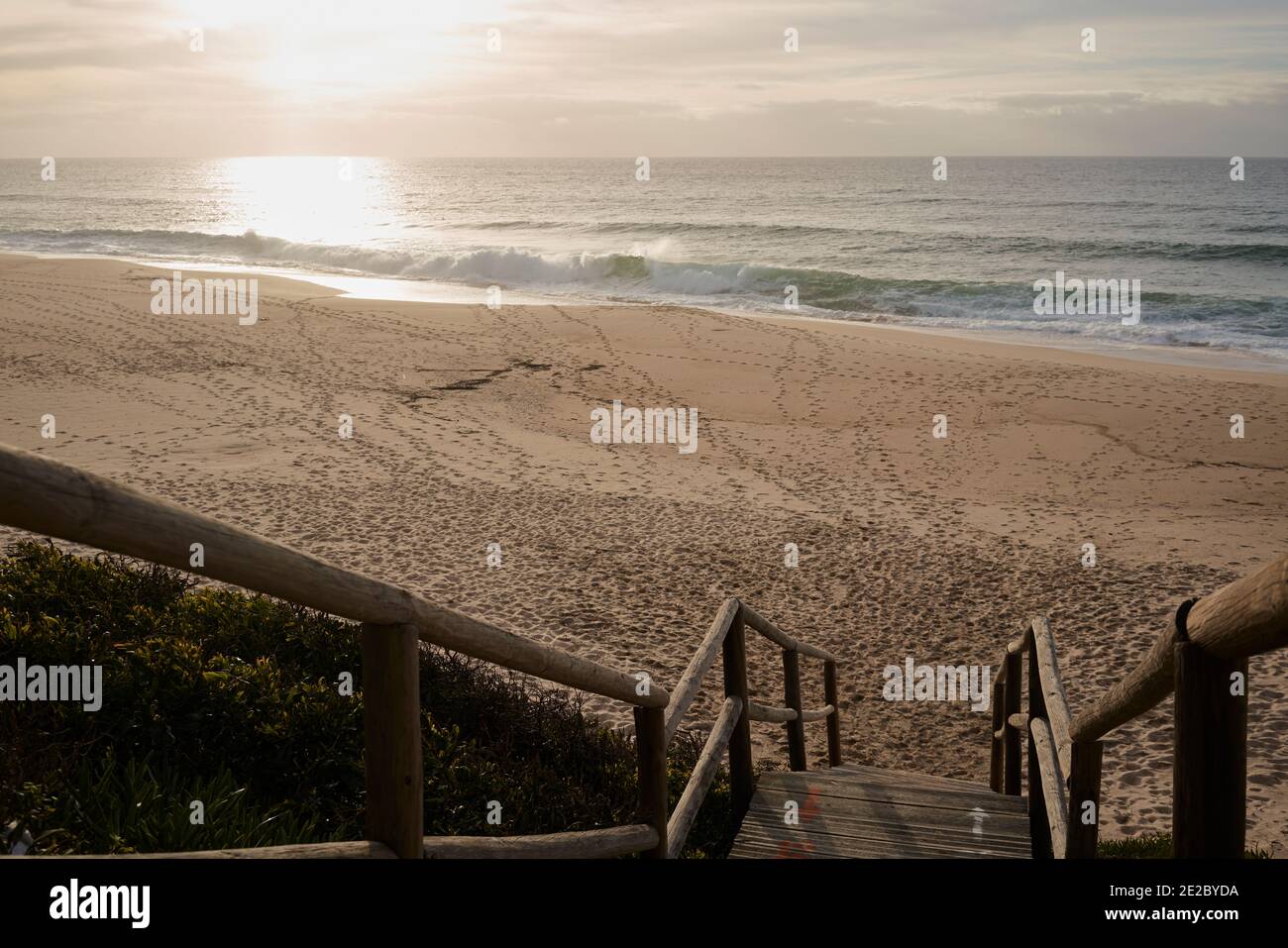 Steps leading down to empty beach along Portuguese coastline Stock ...
