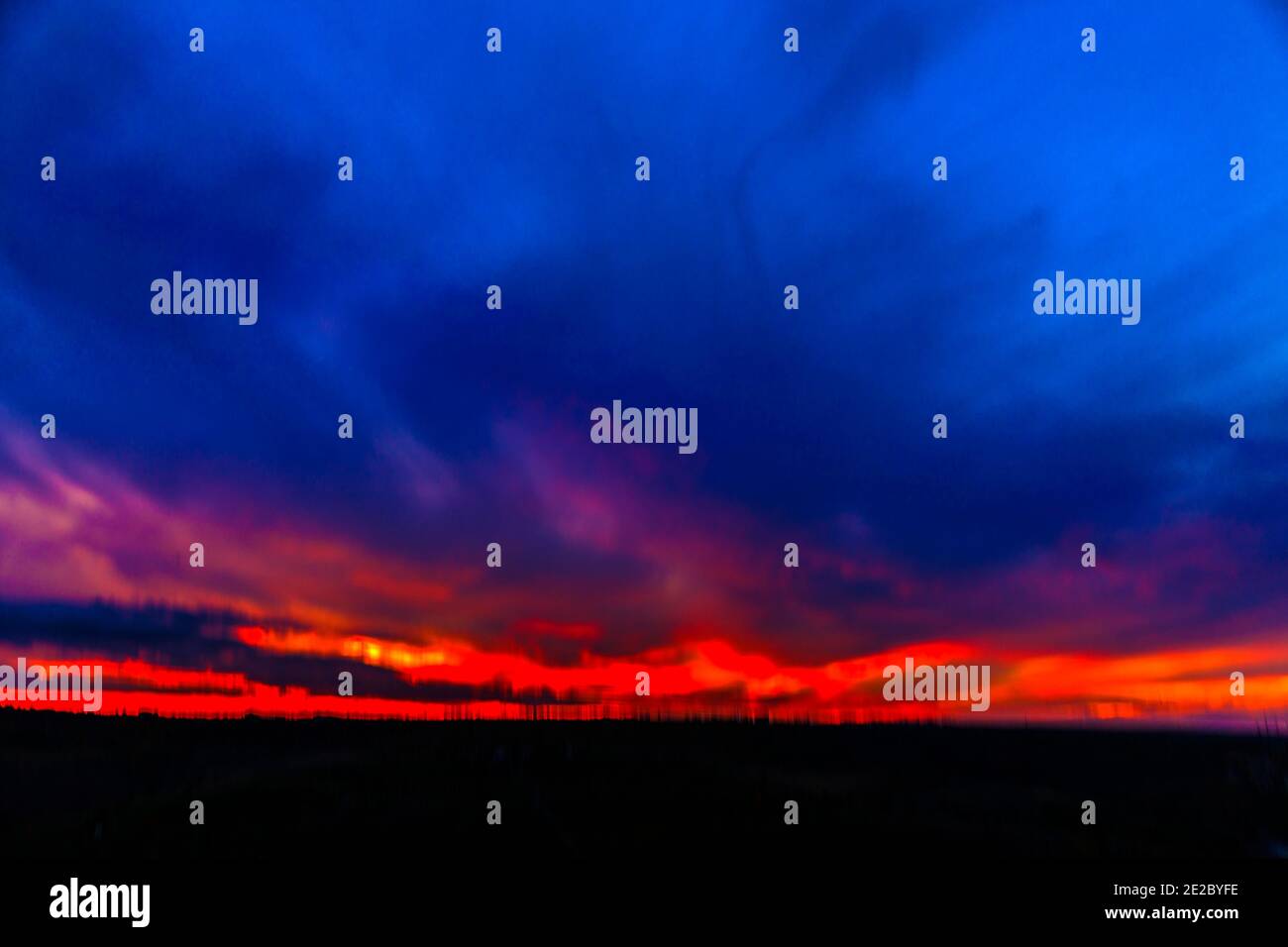 Sunset with red horizon and bright blue sky. This image is specially ...