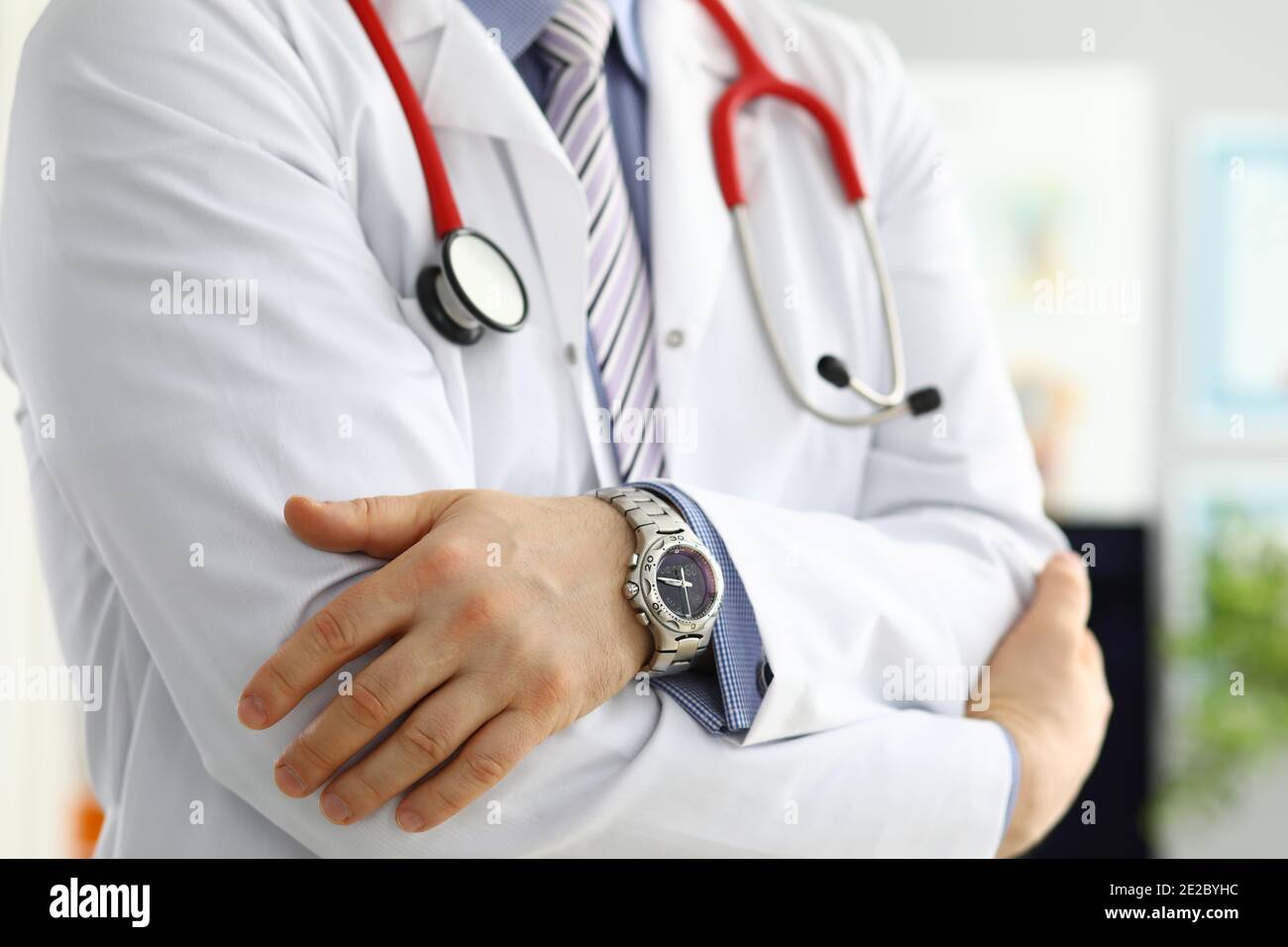Male medicine doctor hands crossed on his chest Stock Photo - Alamy