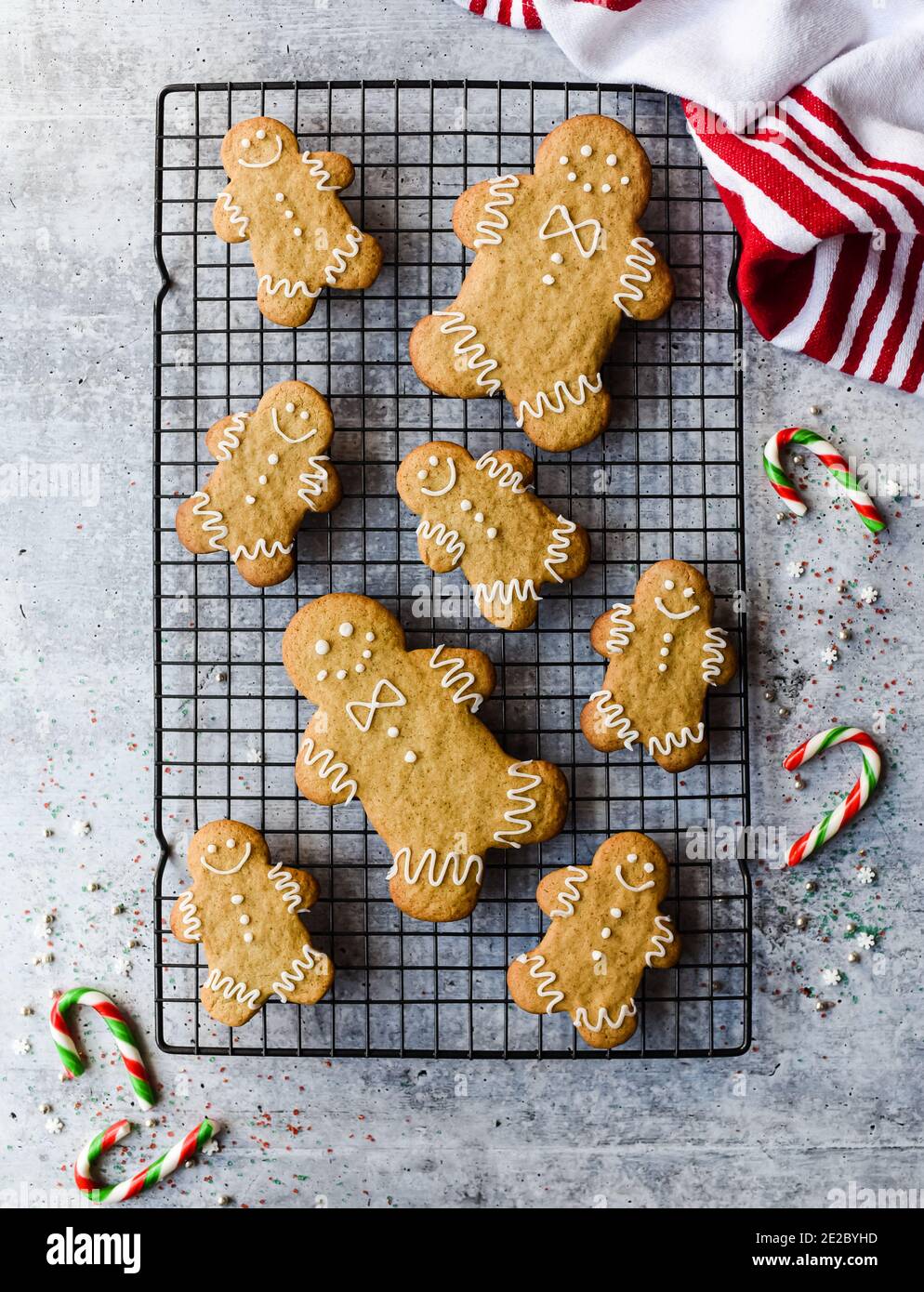 Overhead of gingerbread cookies on wire rack on grey stone counter ...