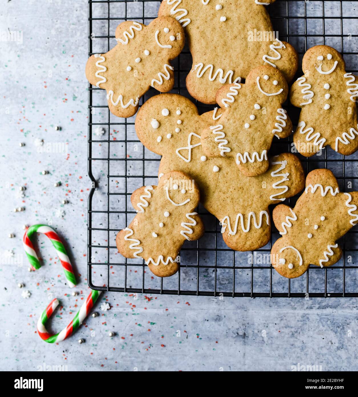 Overhead of gingerbread cookies on wire rack on grey stone counter ...