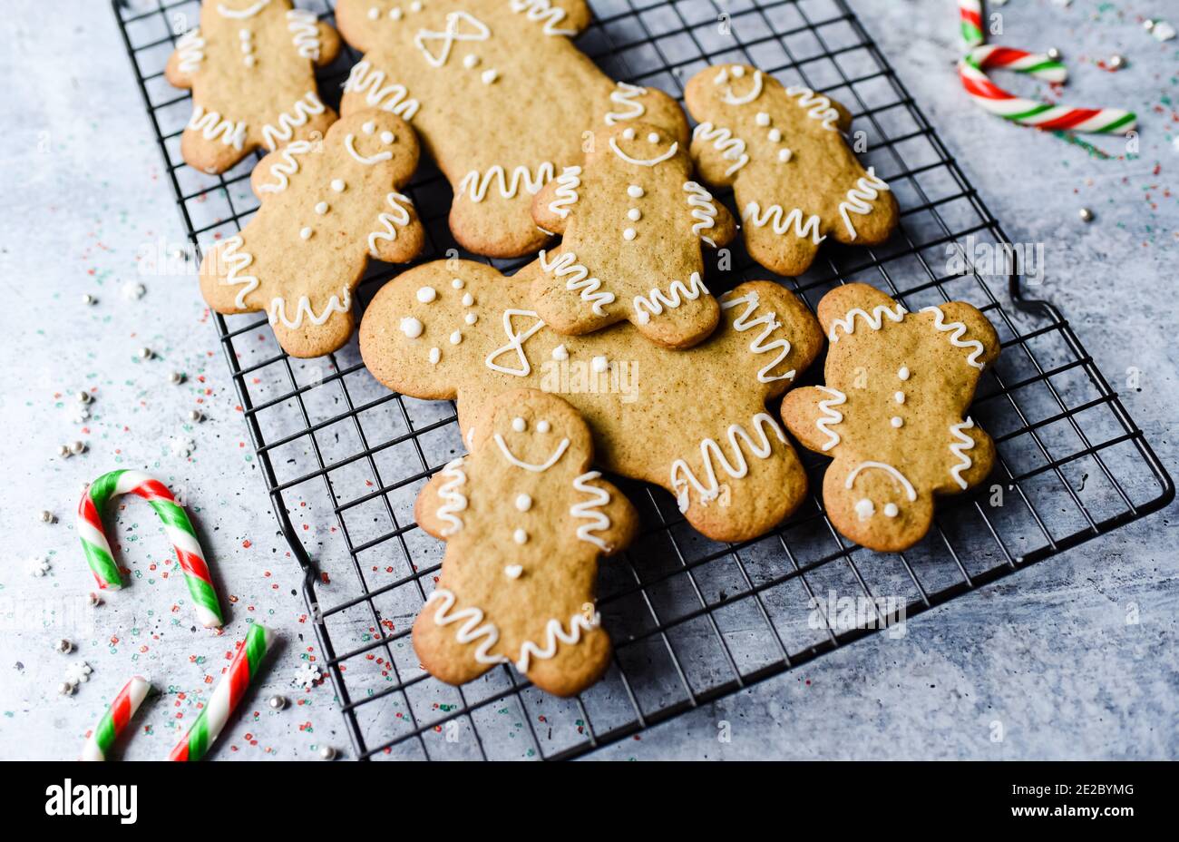 Close up of gingerbread cookies on wire rack on grey stone counter ...