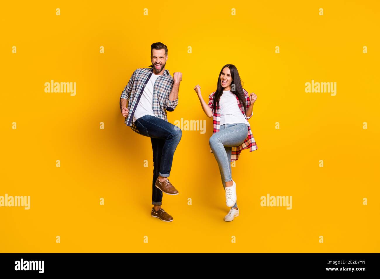 Full length photo portrait of excited wife and husband celebrating ...