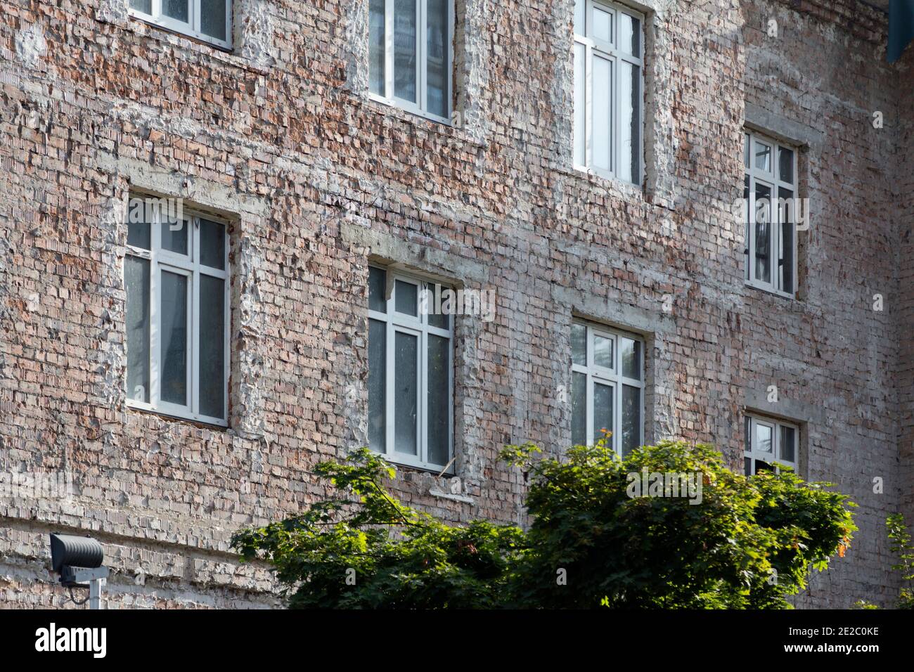 Wall of an old brick building without stucco. Close-up Stock Photo - Alamy