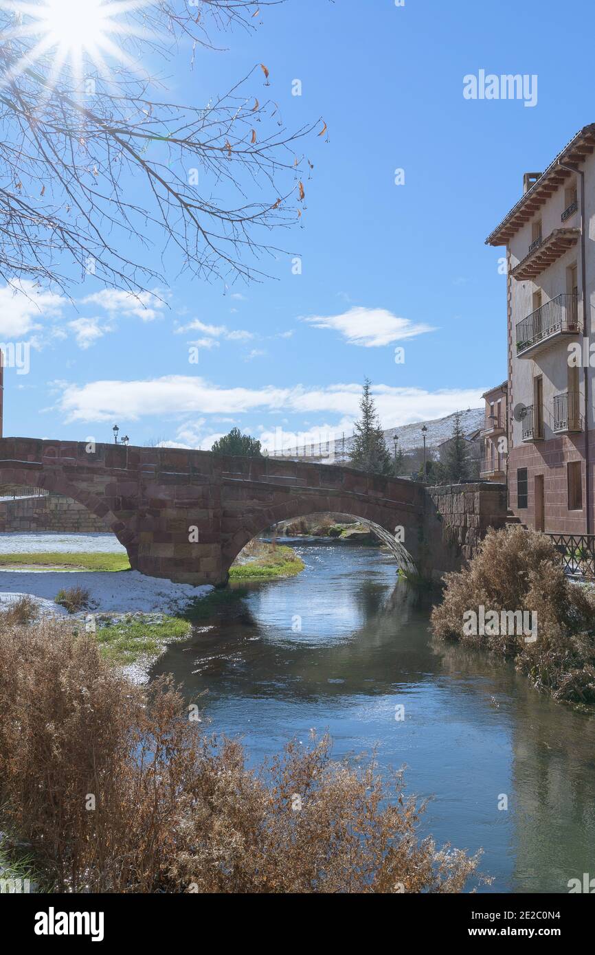 snowy landscape with bridge in the town of Molina de Aragon in the ...