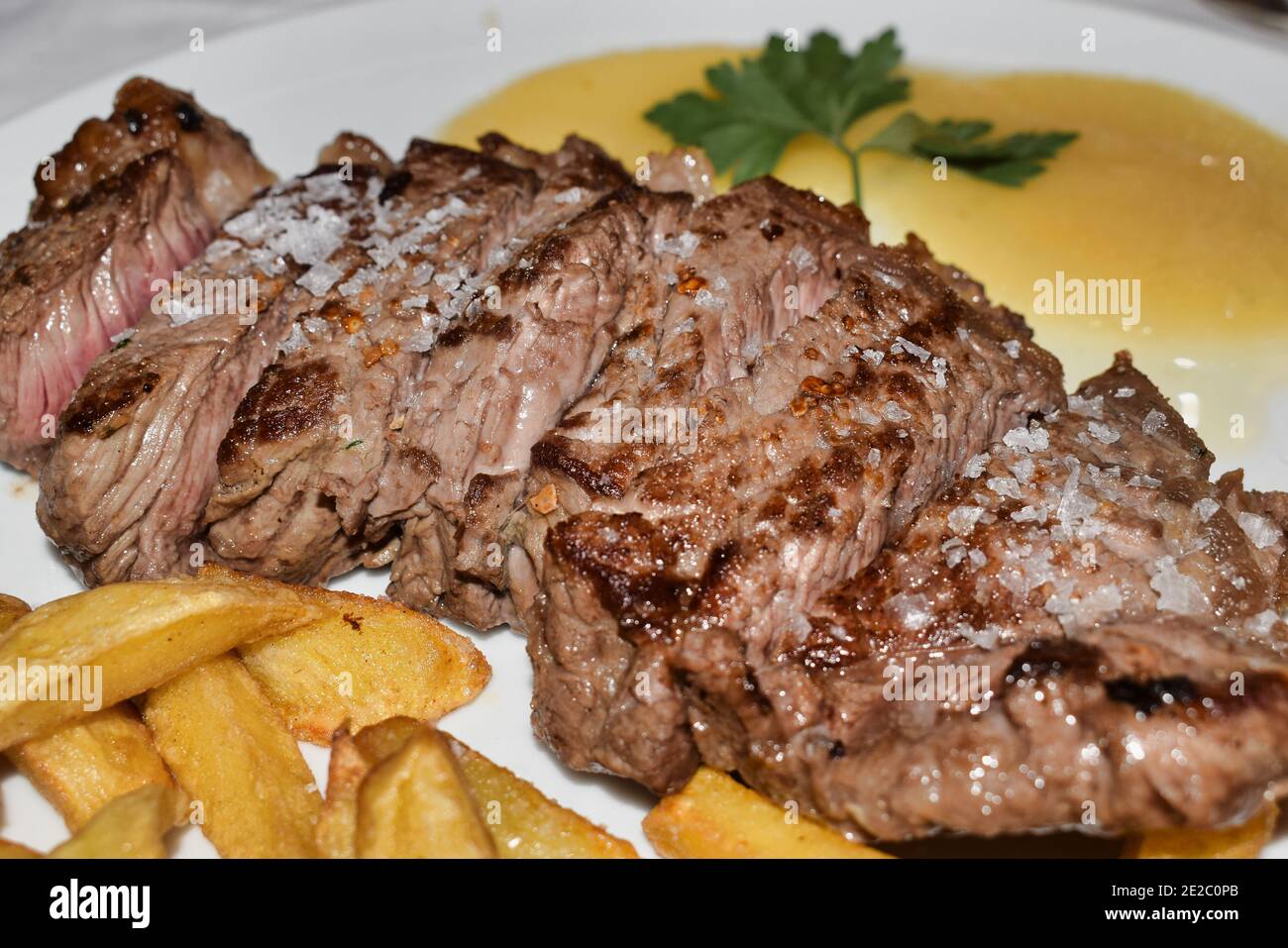 Grilled beef entrecote cut and with coarse salt flakes Stock Photo - Alamy