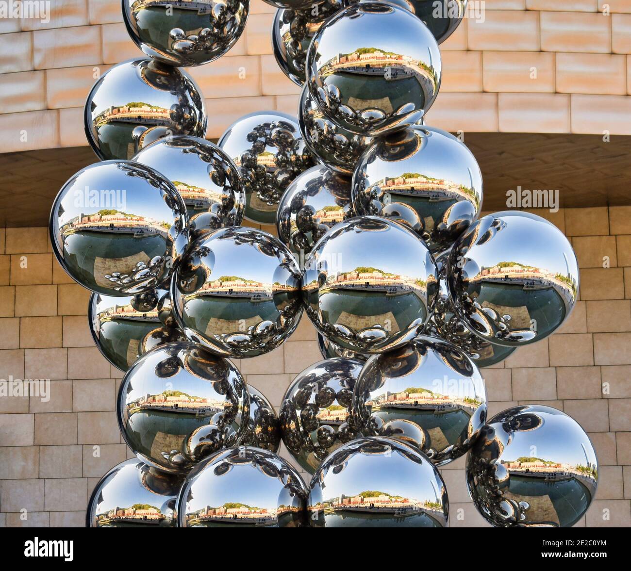 In metal balls of a modern sculpture outside the Guggenheim museum in ...