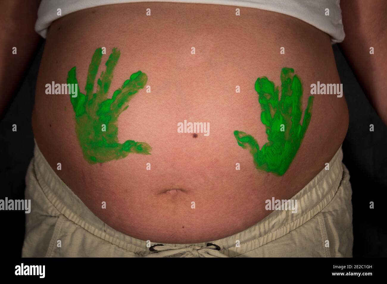 Pregnant mom paint abdomen hi-res stock photography and images - Alamy