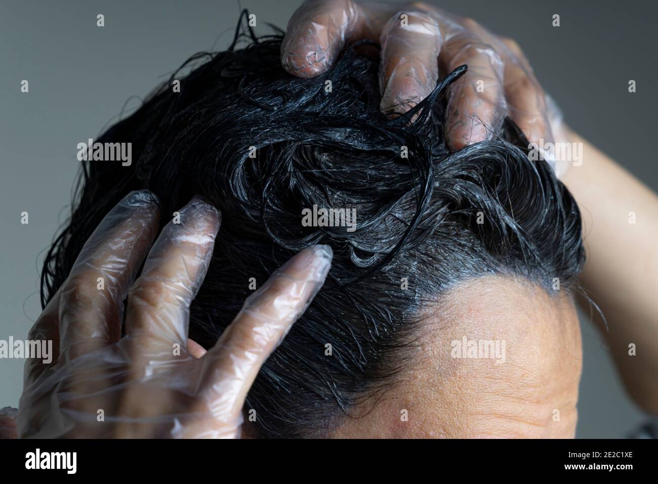 Applying hair dye roots woman hi-res stock photography and images - Alamy