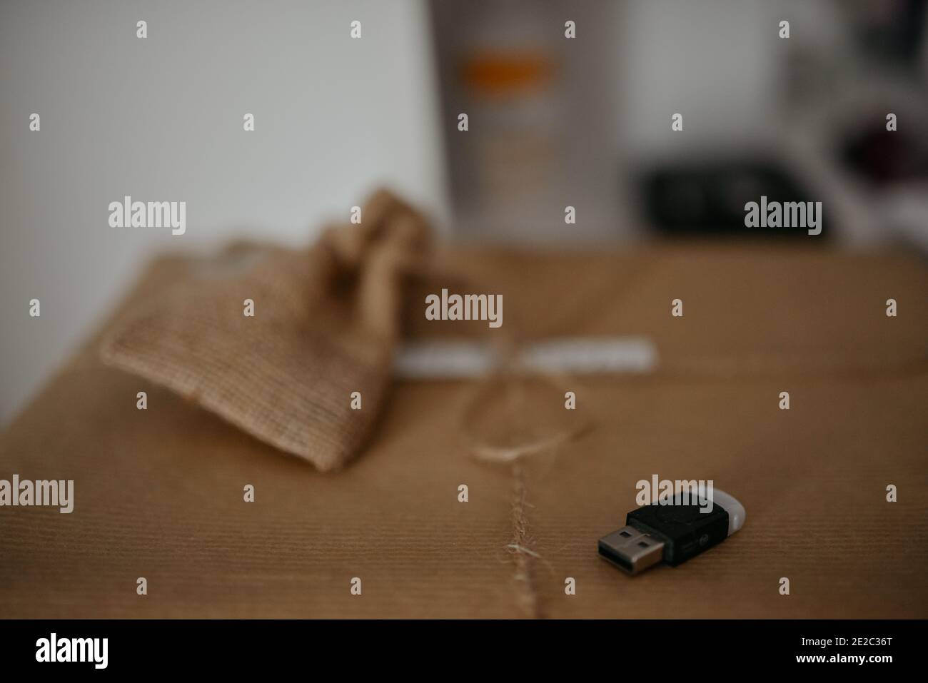 Small USB flash drive on a cardboard box Stock Photo - Alamy