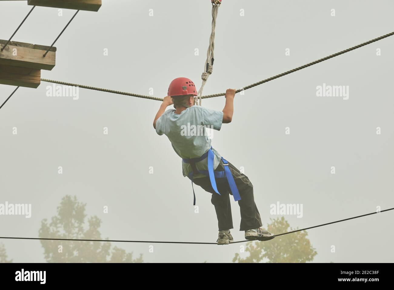High Ropes Experience during school camp. student loosing balance on ...