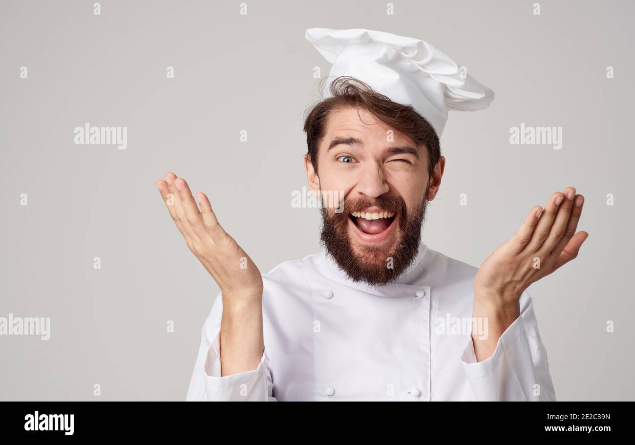 Male chef Cook caps emotions restaurant professional work in the ...