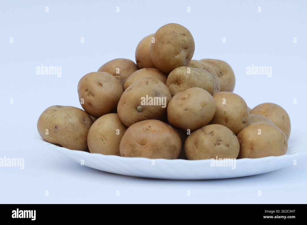 Baby potatoes small round potato from india on white background Asian ...