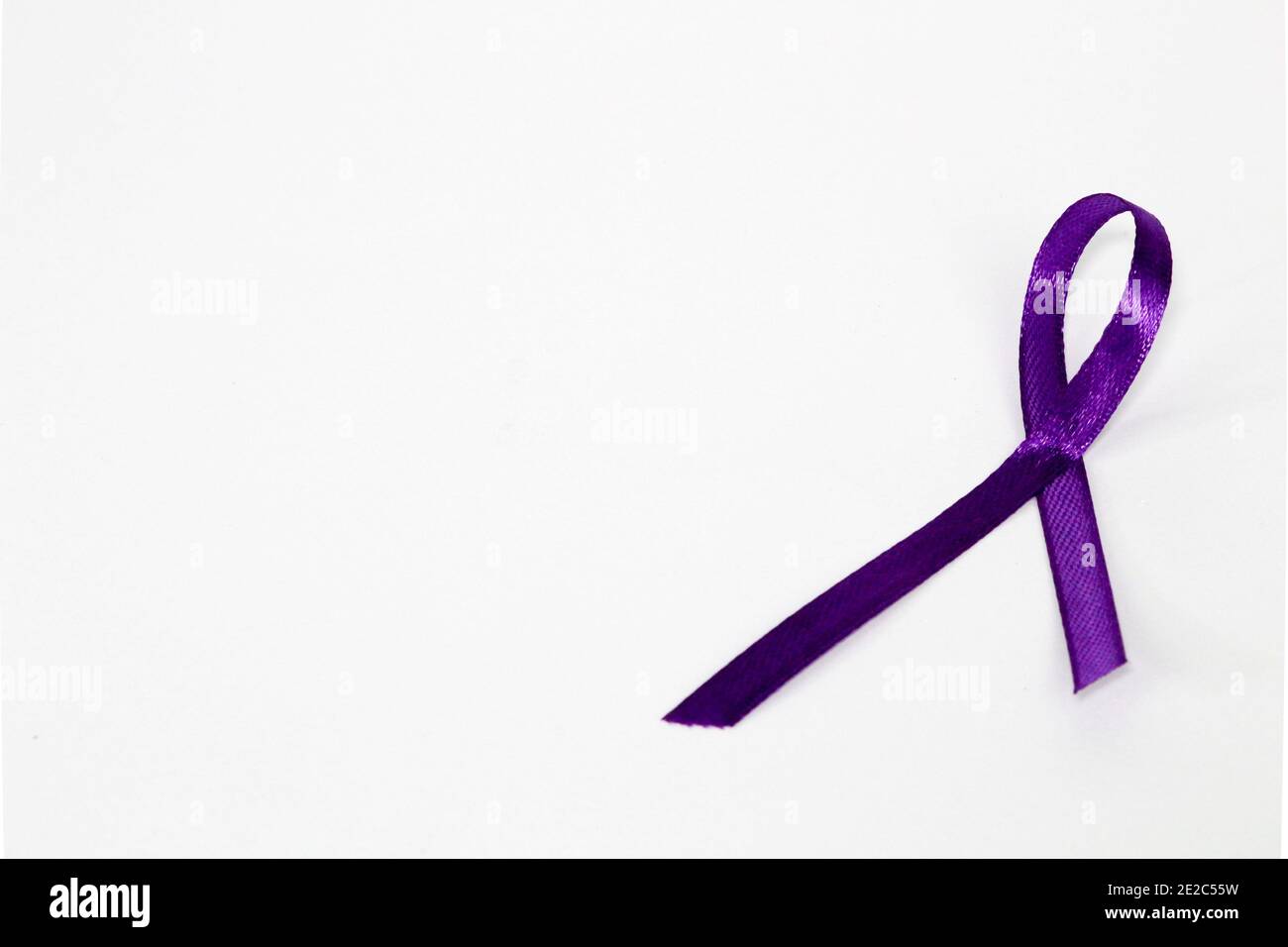 Colorful purple awareness ribbon on white background Stock Photo - Alamy