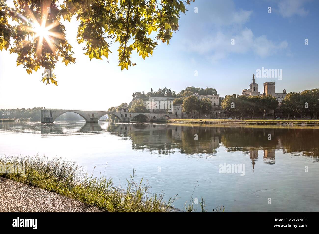 Avignon, Palace of Popes with famous bridge during evening in Provence ...
