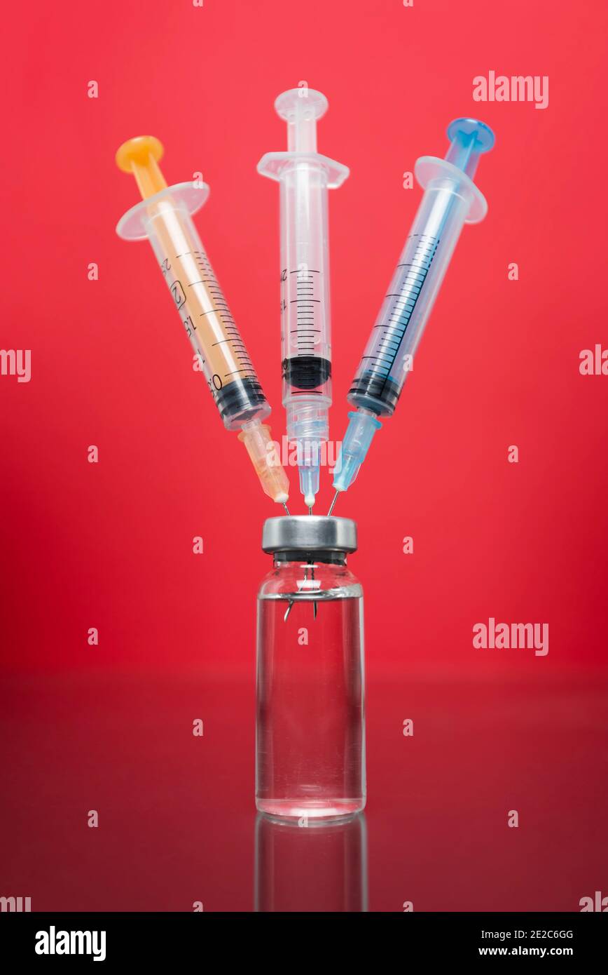 The injection syringes are stuck in a bottle of liquid Stock Photo - Alamy
