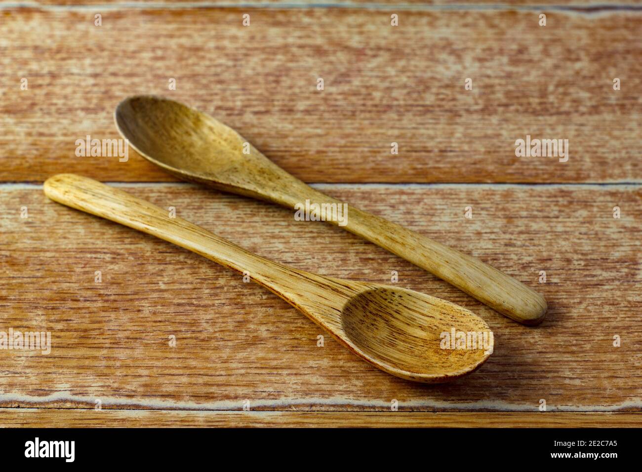 two spoon of olive wood brown Stock Photo - Alamy