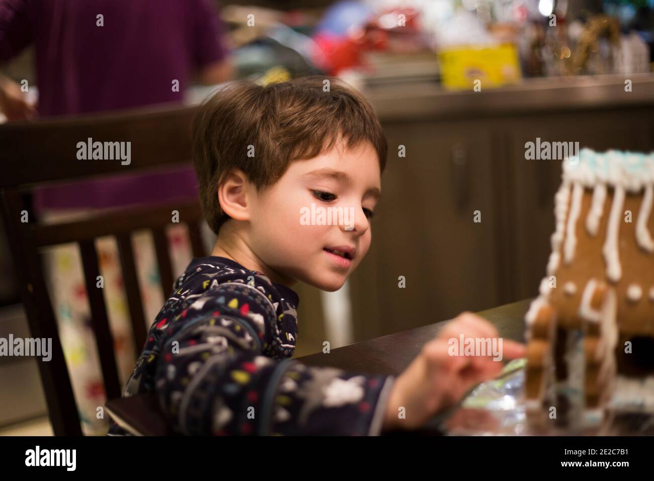 Cute boy making cookie Stock Photo - Alamy