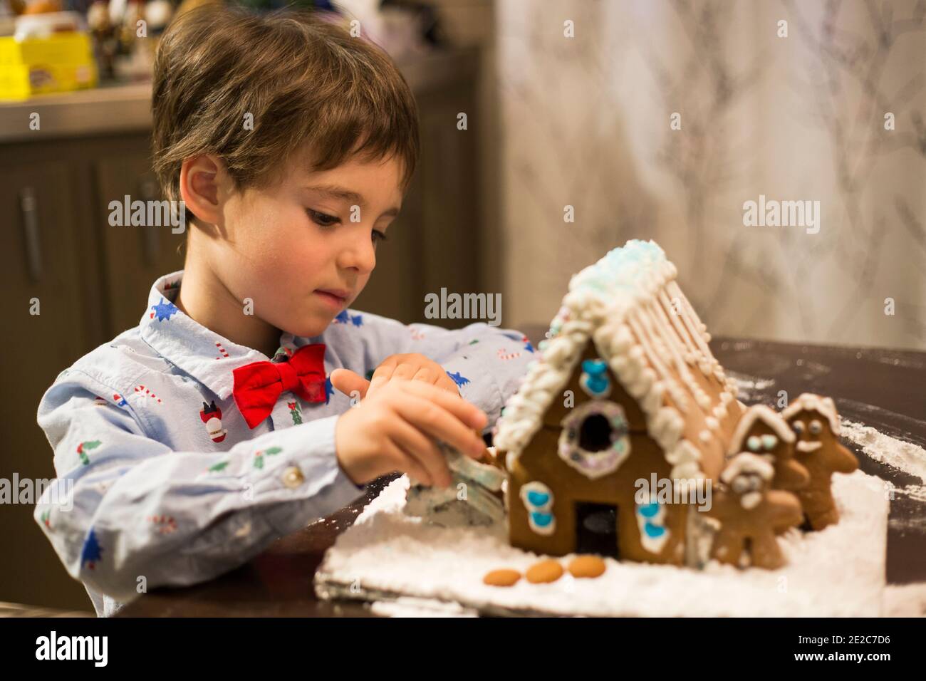 Cute boy making cookie Stock Photo - Alamy
