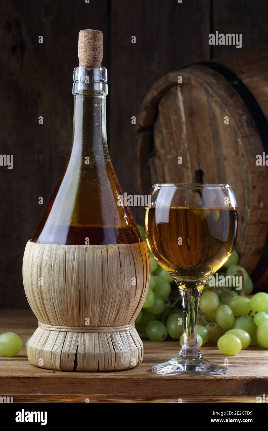 Still life with white wine and grapes Stock Photo - Alamy