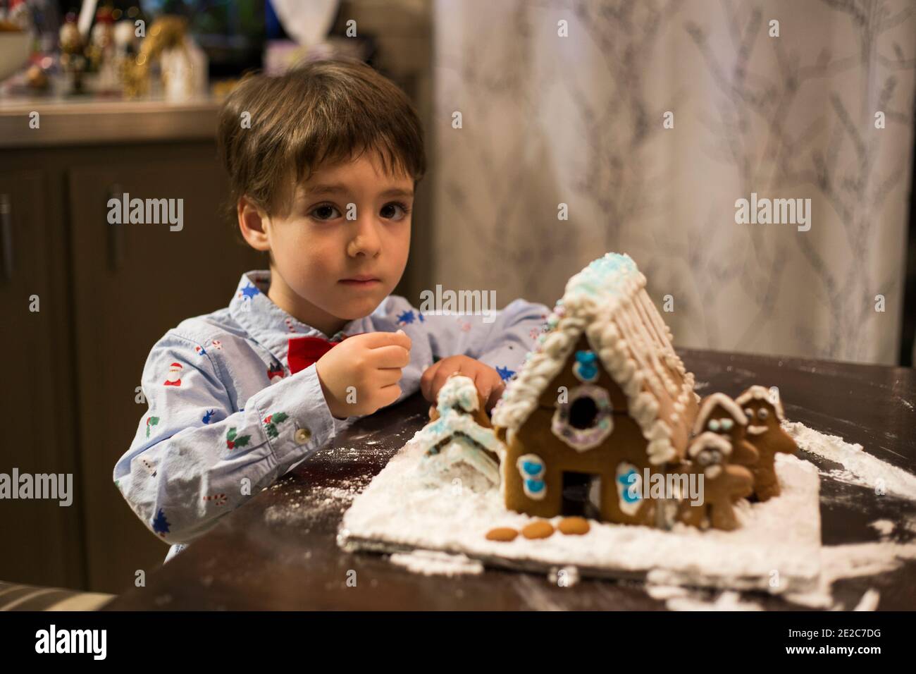 Cute boy making cookie Stock Photo - Alamy