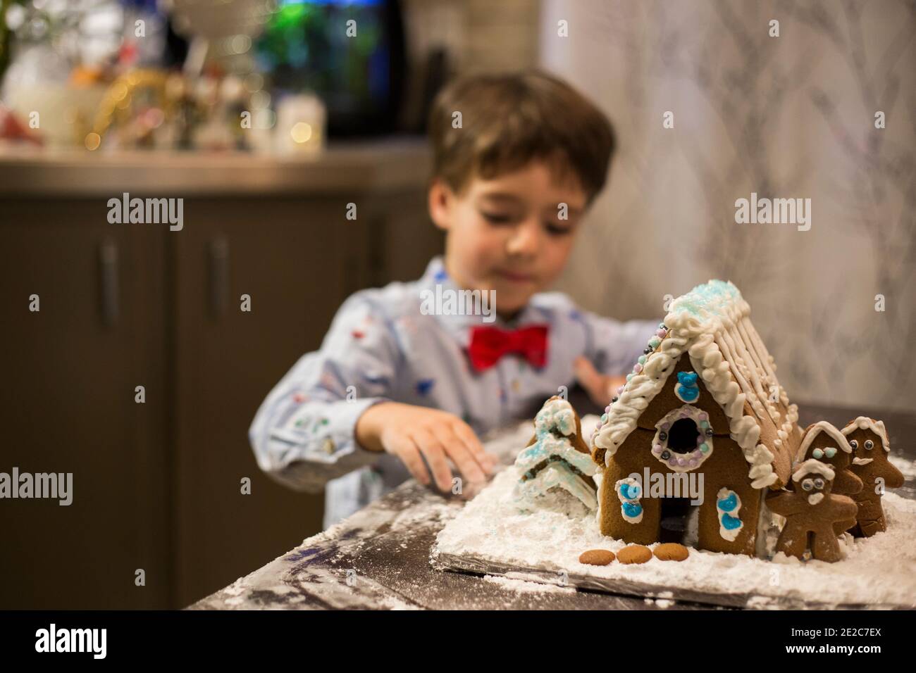 Cute boy making cookie Stock Photo - Alamy