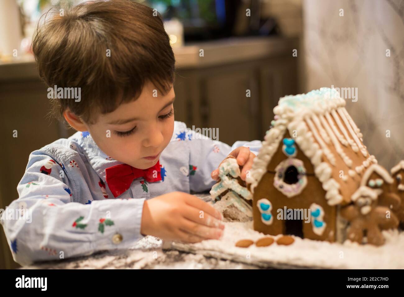 Cute boy making cookie Stock Photo - Alamy