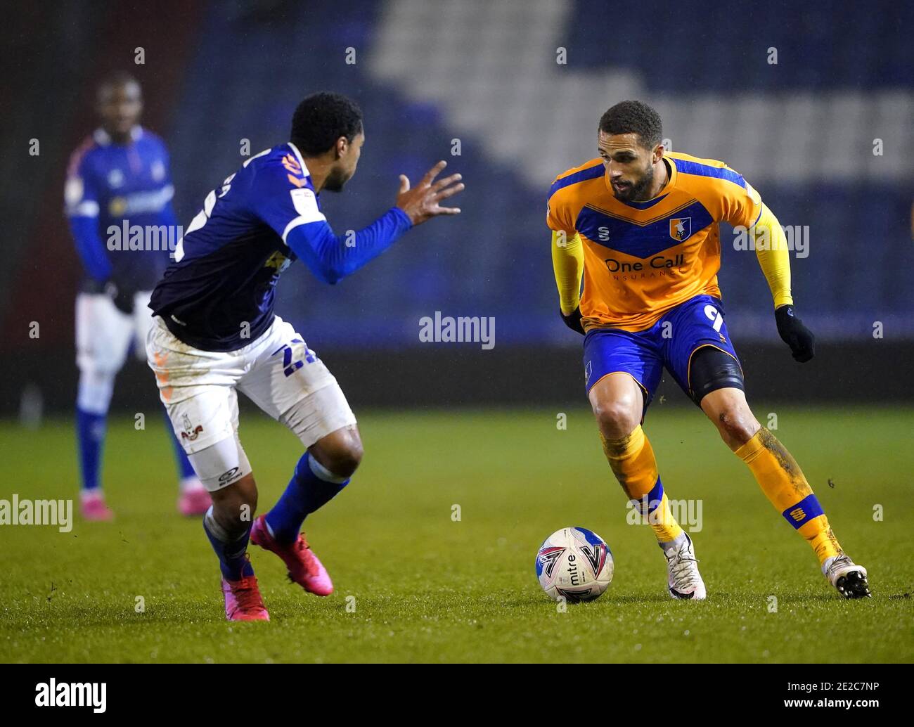 Oldham Athletic's Raphael Diarra (left) and Mansfield Town's Jordan ...