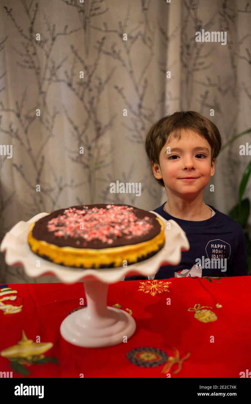 Cute boy making cookie Stock Photo - Alamy