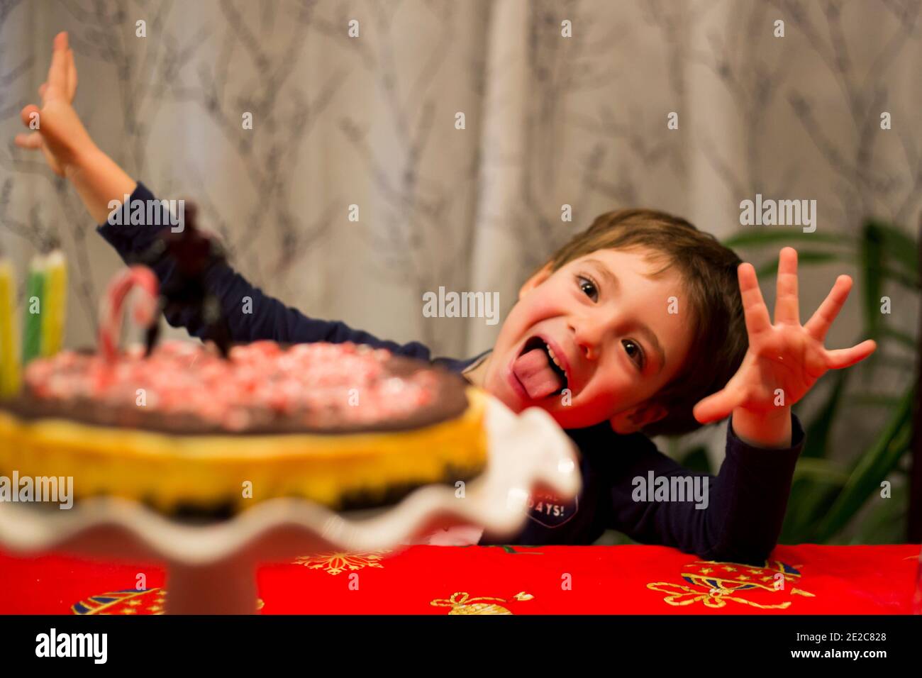 Cute boy making cookie Stock Photo - Alamy