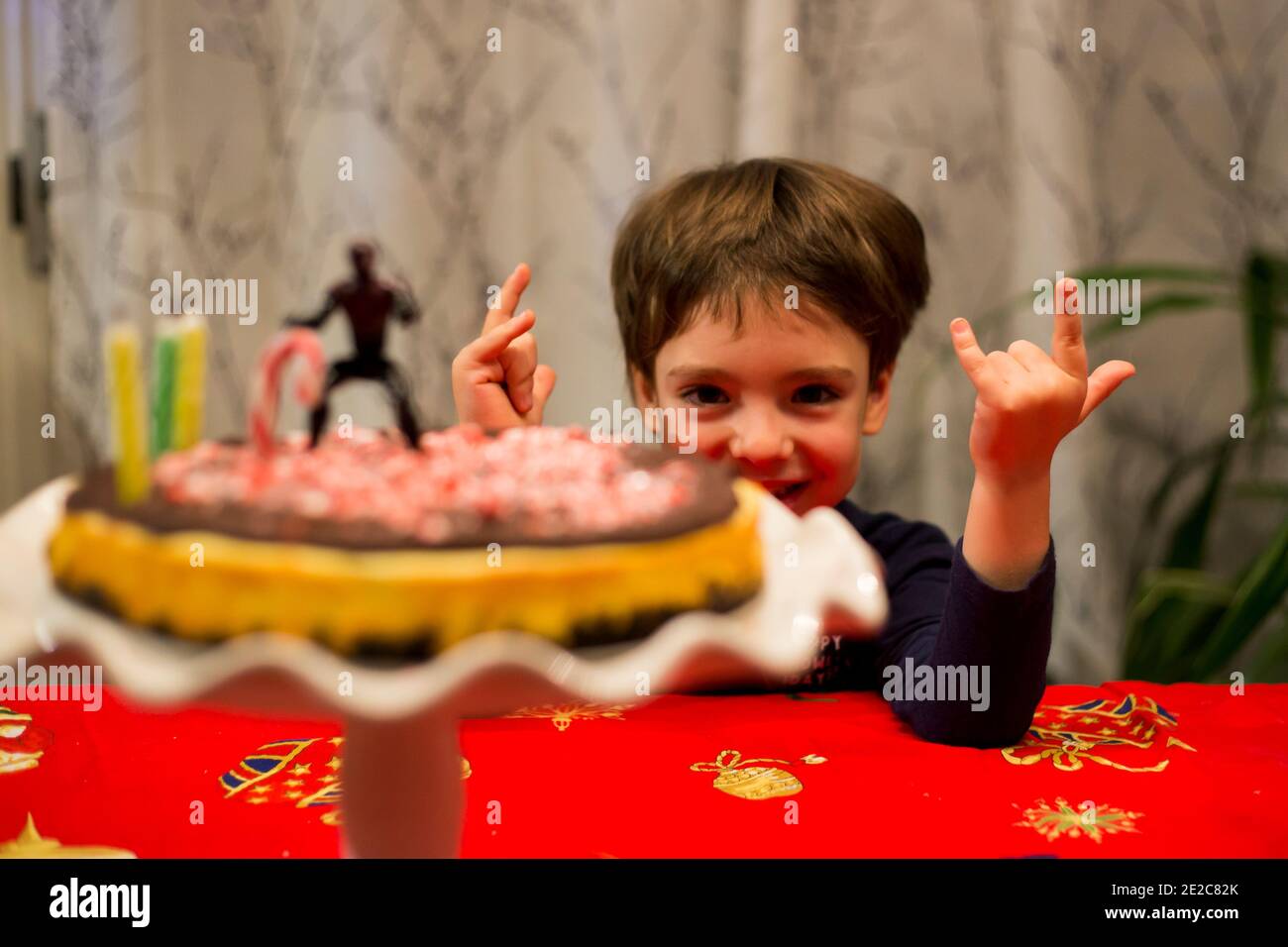 Cute boy making cookie Stock Photo - Alamy