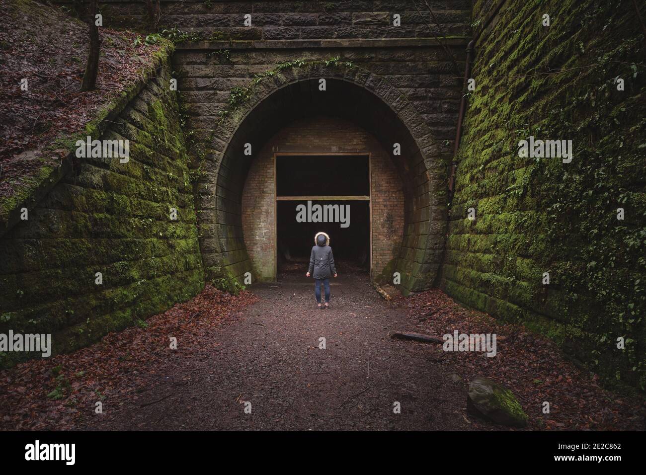 A young woman looks ahead into a dark, empty void that is the Neidpath ...