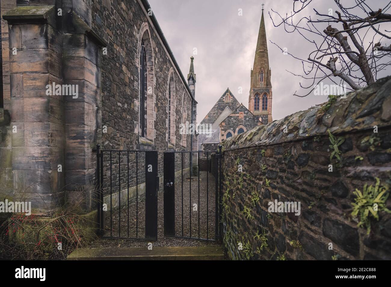 An old stone wall leading to Saint Andrews Leckie Parish Church in ...
