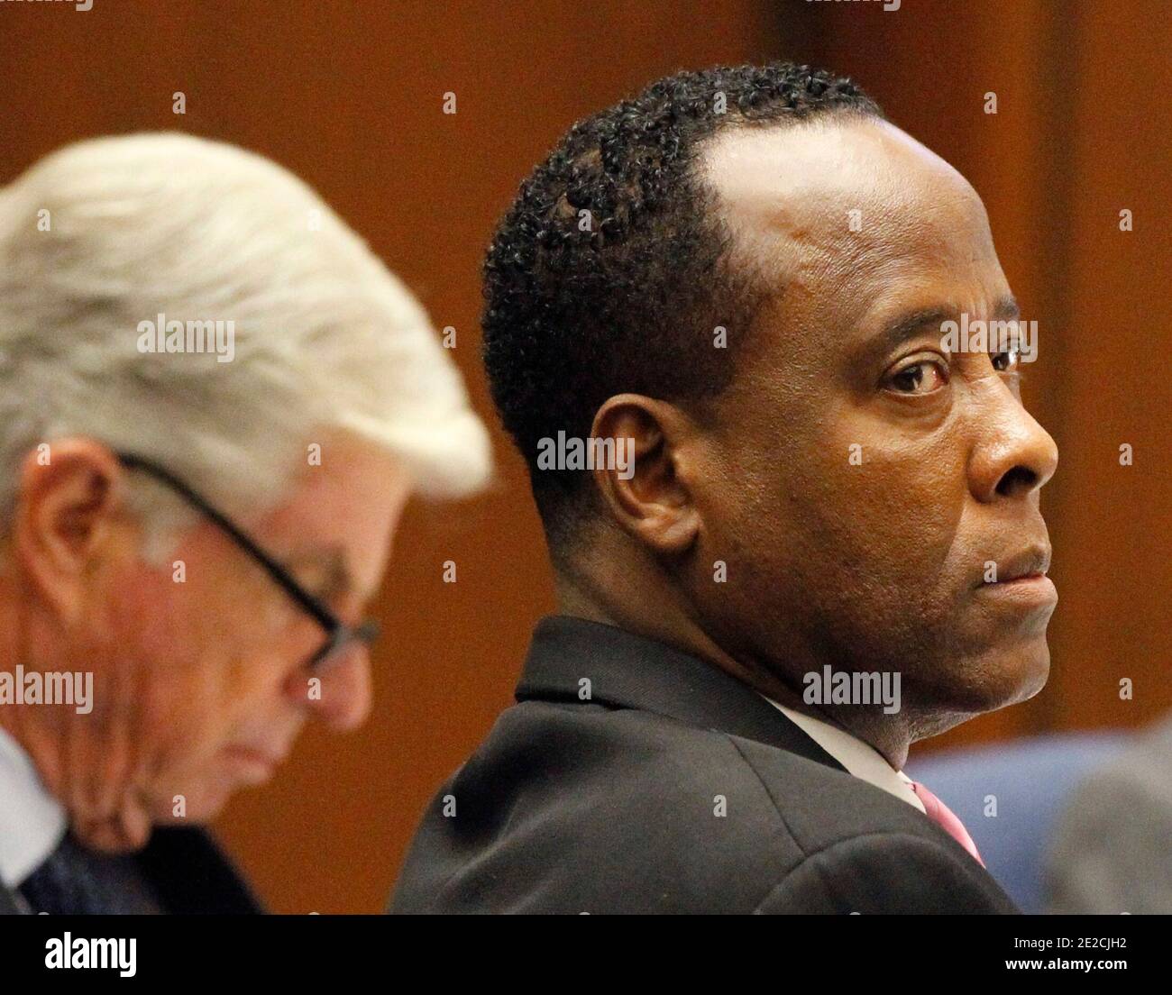 Dr.Conrad Murray sits at the defense table with his attorney J. Michael ...