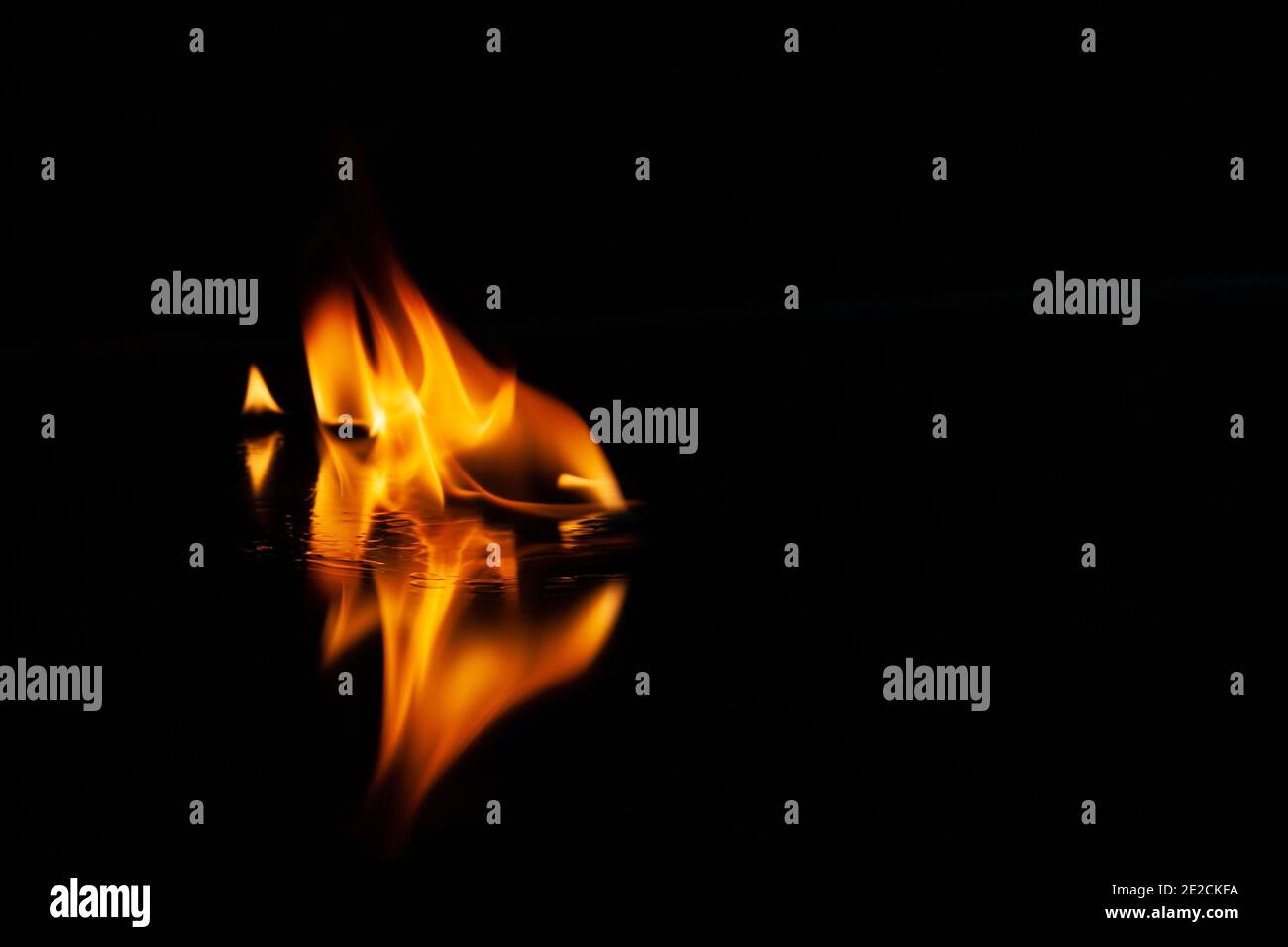 fire flame with reflection in the glass on a black background Stock ...