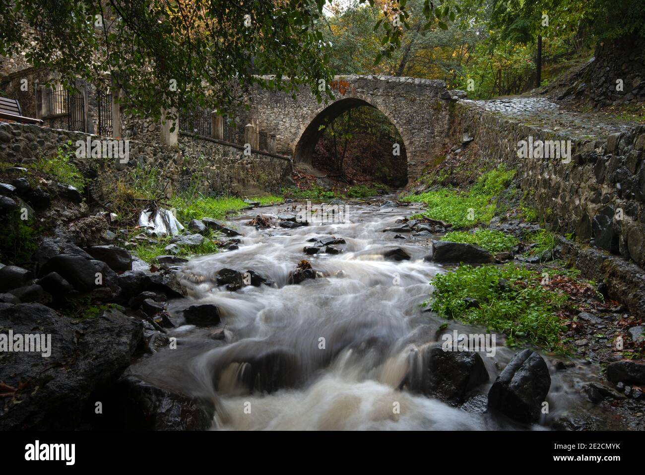 Medieval stoned bridge water flowing in the river Stock Photo - Alamy
