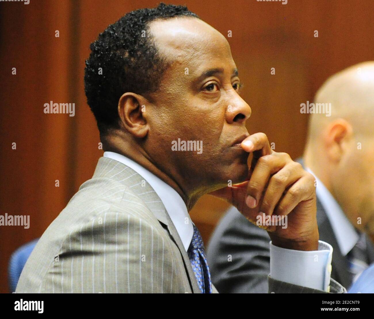 Dr. Conrad Murray listens as his defense attorney Ed Chernoff cross ...