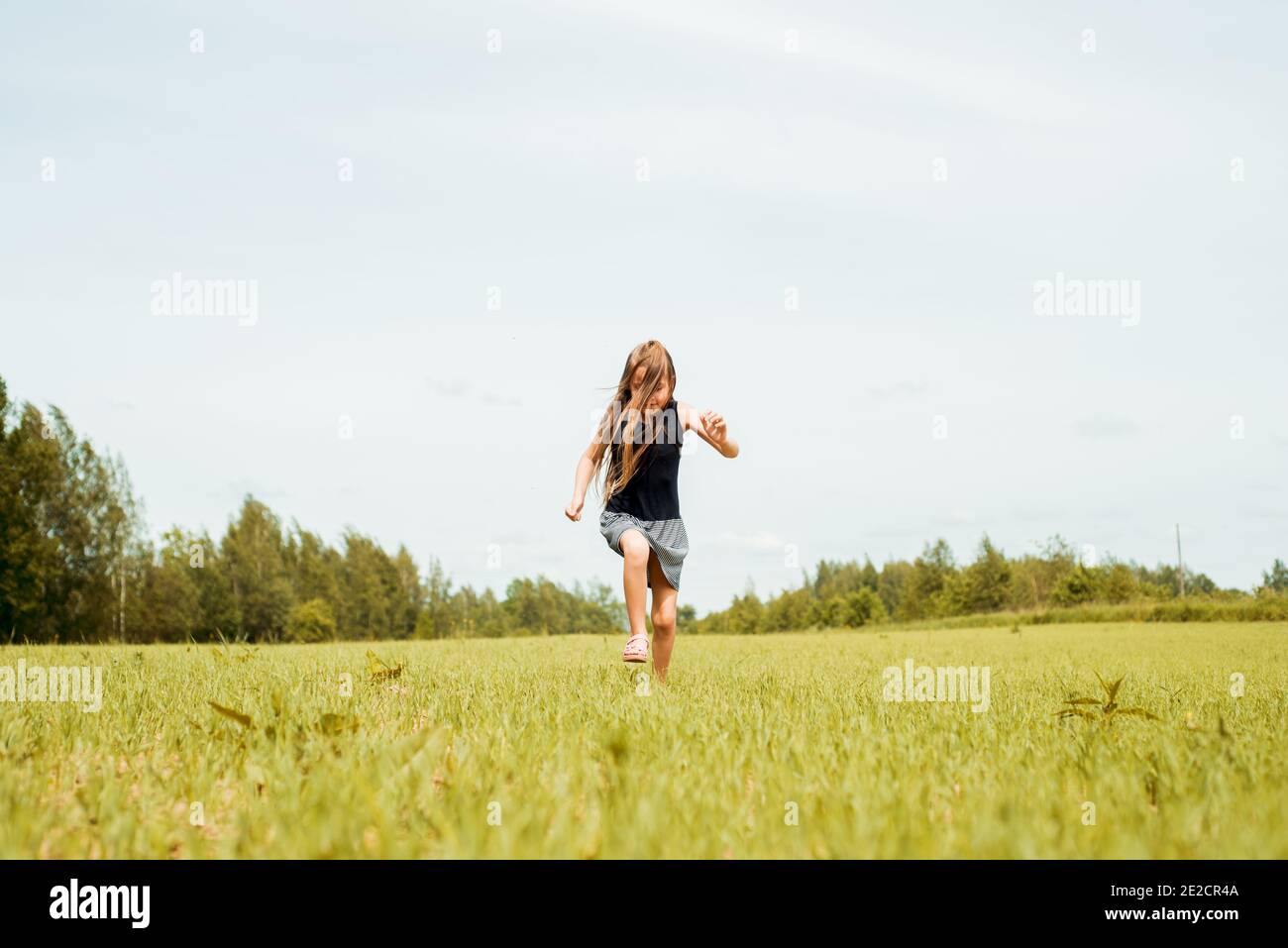Little Girl Running In Field