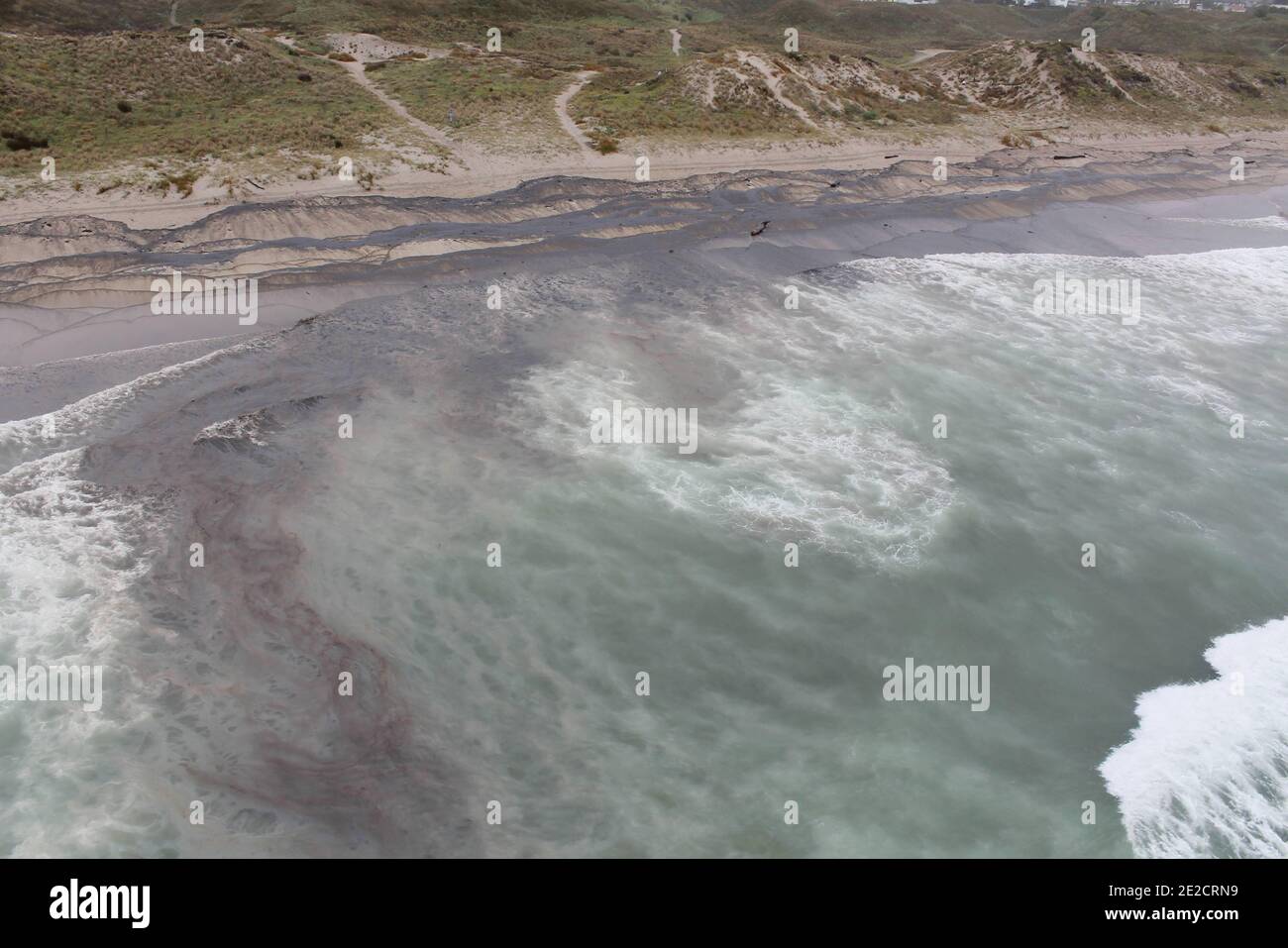 Oil washing up on the shoreline of Tauranga, New Zealand, on October 12 ...