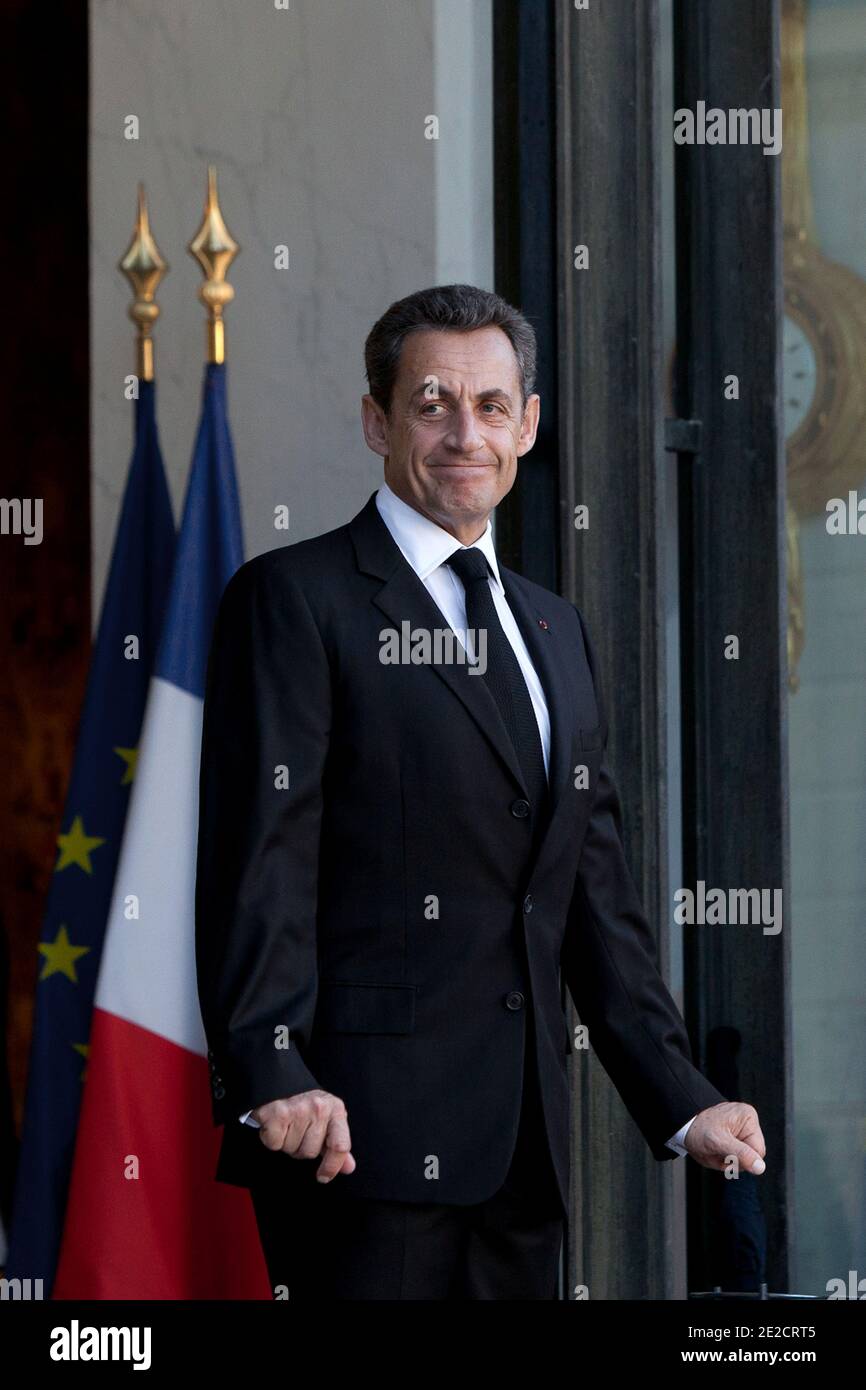 French President Nicolas Sarkozy waits for European Commission President Jose Manuel Barroso ...