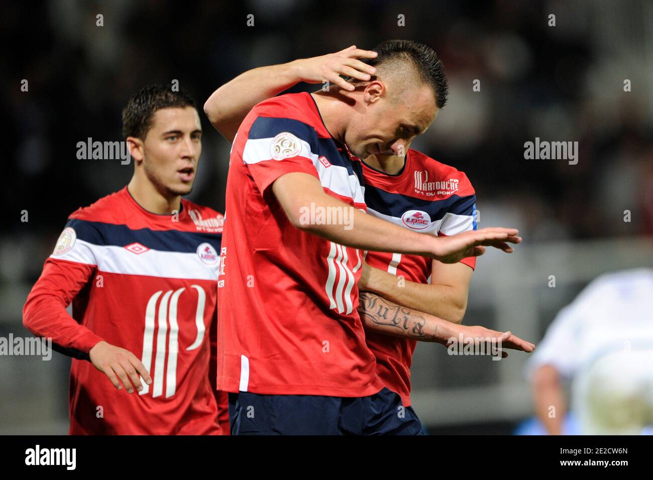 Lille's Joe Cole and Eden Hazard congratulating Ireneusz Jelen who ...