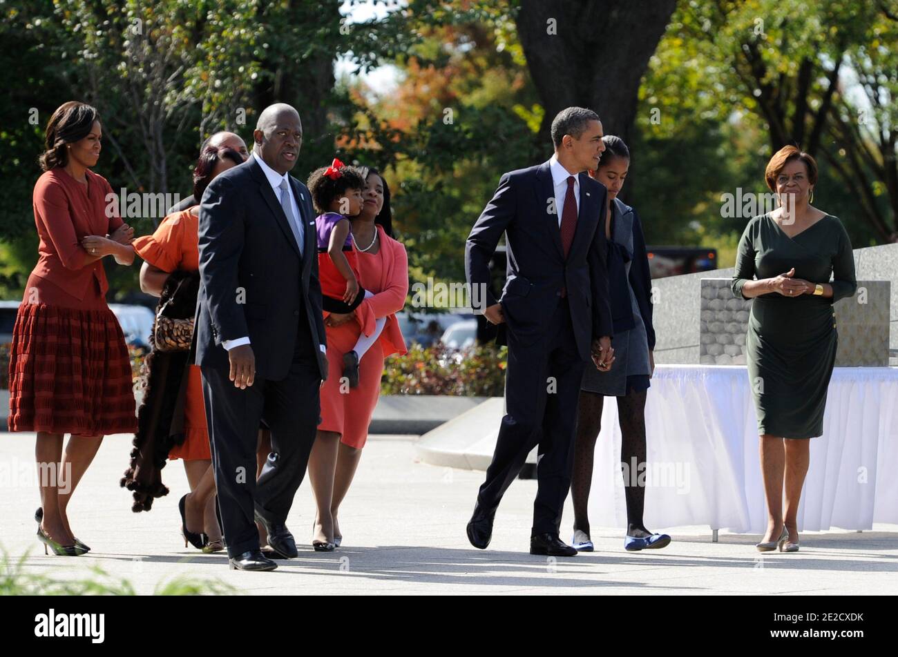U.S. President Barack Obama, walks hand-in-hand with daughter Malia as ...
