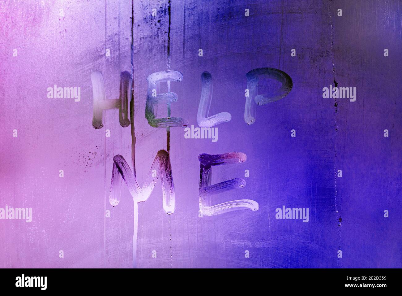 words help me handwritten on night wet window glass with purple and ...
