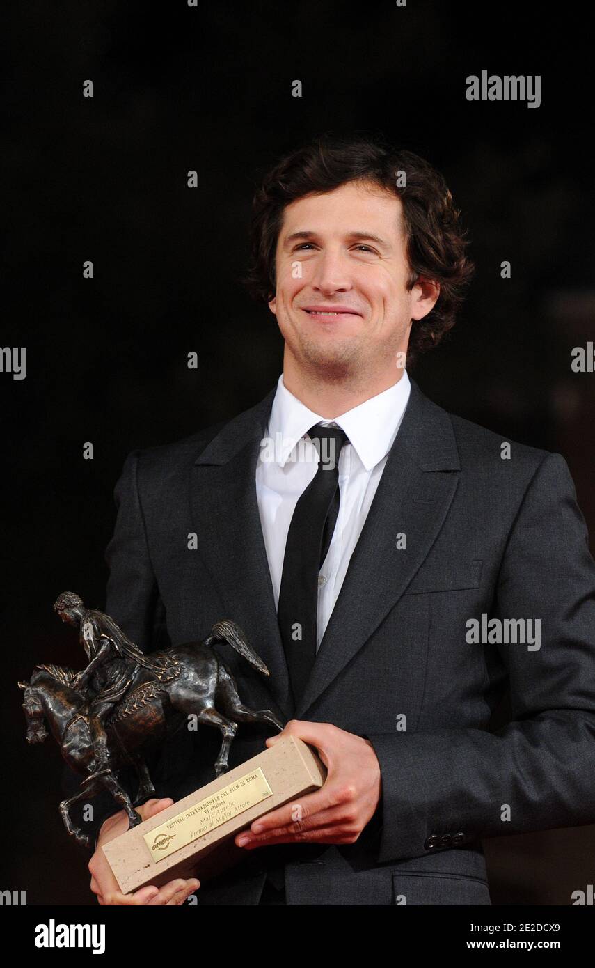 Actor Guillaume Canet poses with his Marc Aurelio Best Actor award for ...