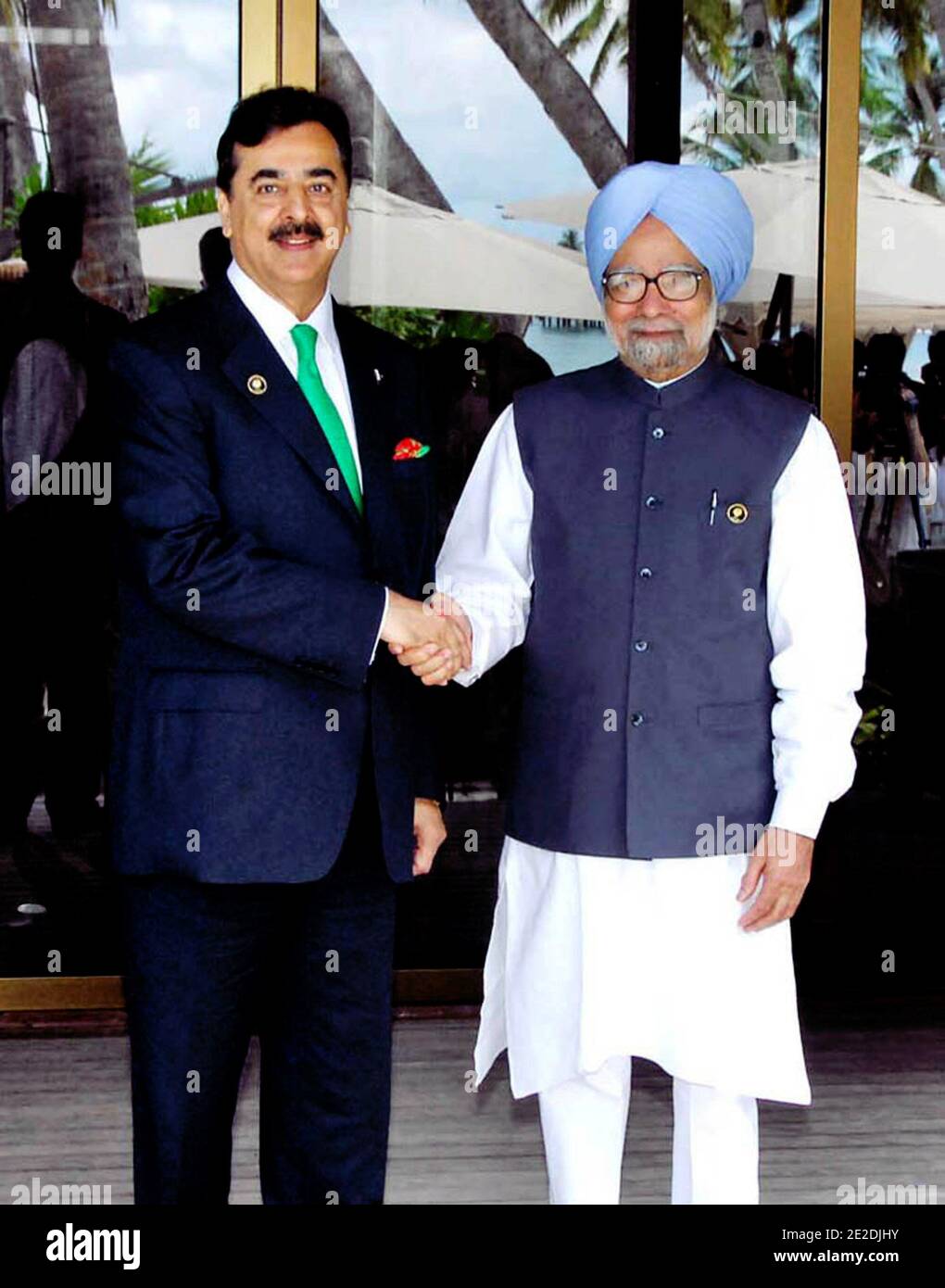 Prime Minister Syed Yusuf Raza Gilani shaking hands with his Indian ...
