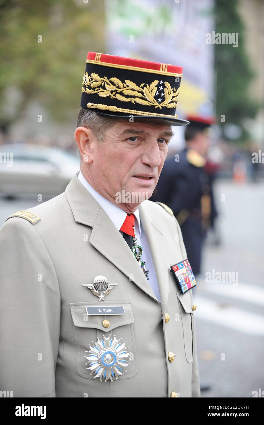 General Benoit Puga is pictured near the statue of Georges Clemenceau ...