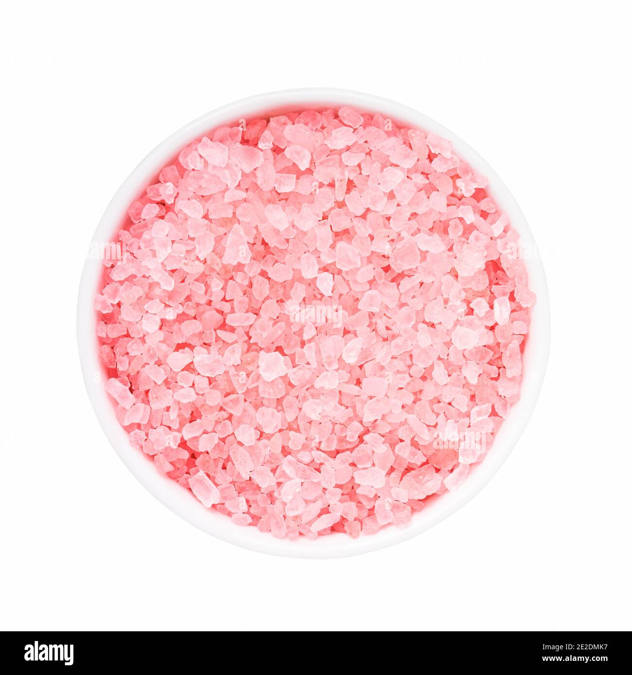 SPA concept. Pink bath salt in bowl isolated over white background with ...