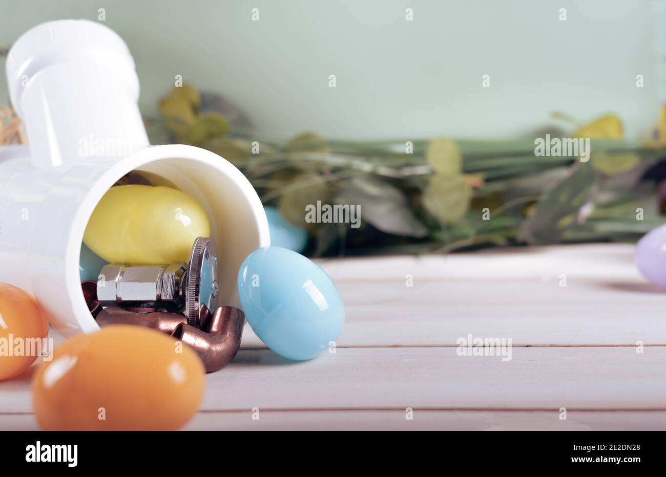 Easter Egg and plumbing tools, copper pipes and fittings. Holiday ...