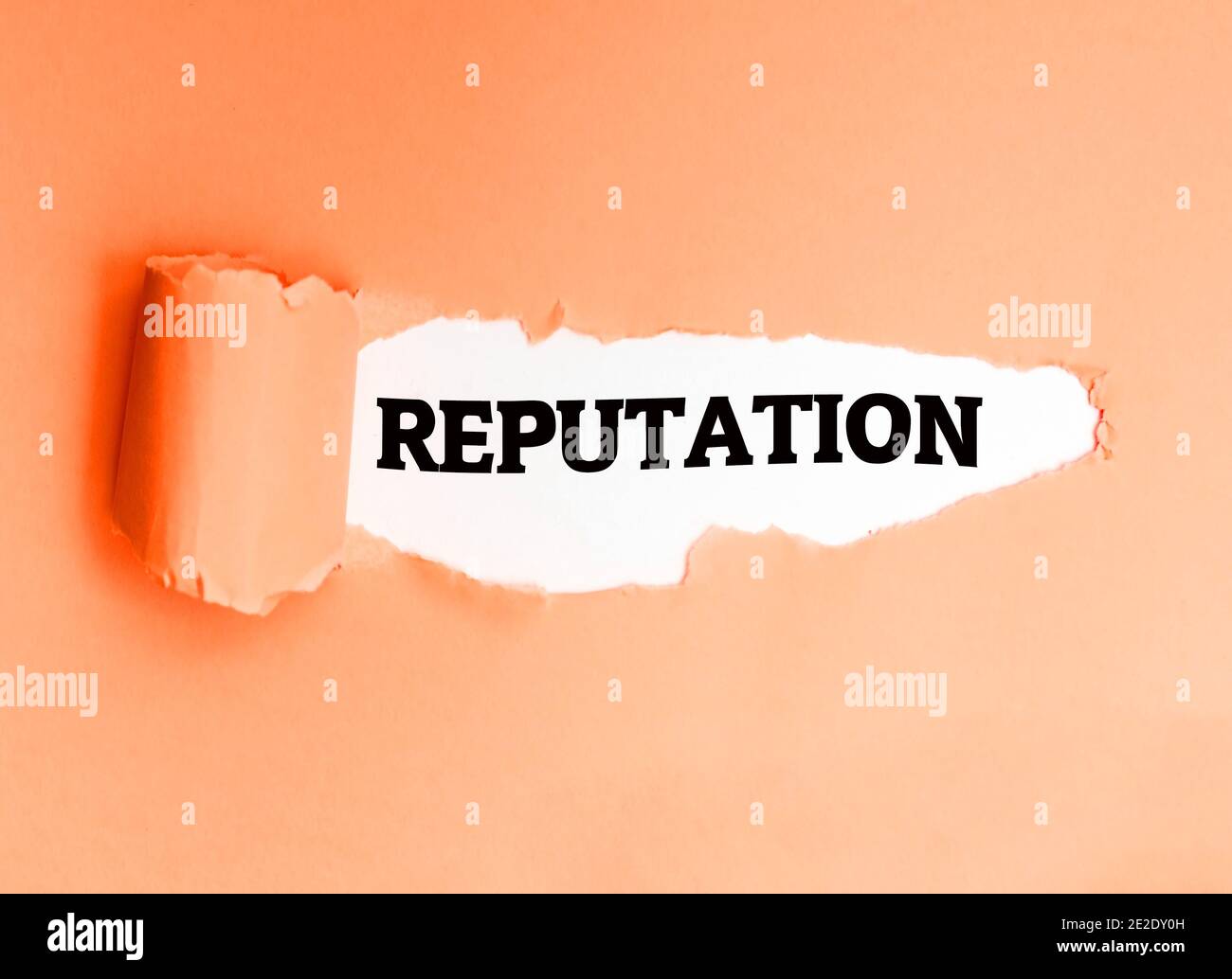 Reputation, written in English on a torn paper, encouraging action ...