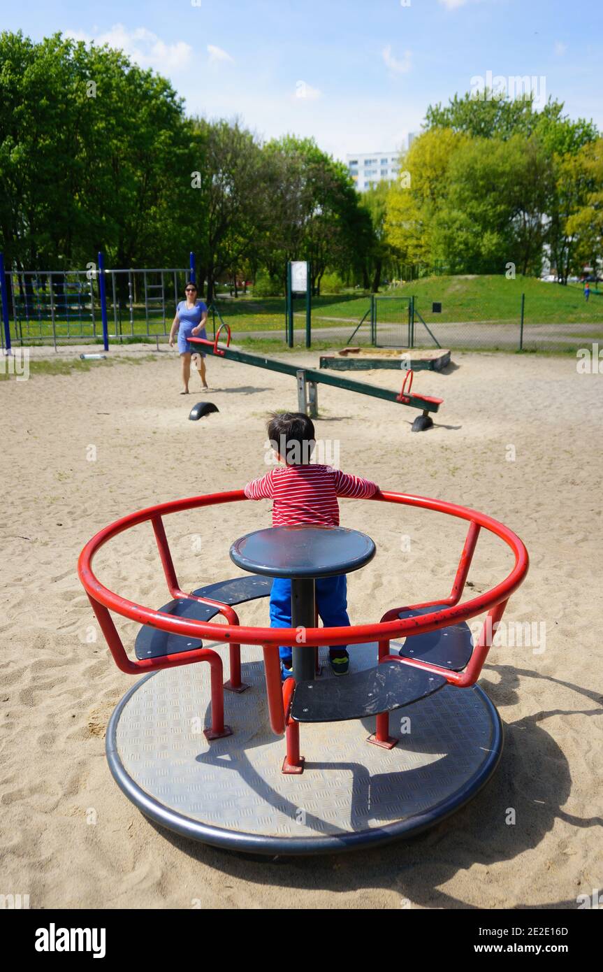 One child roundabout hi-res stock photography and images - Alamy